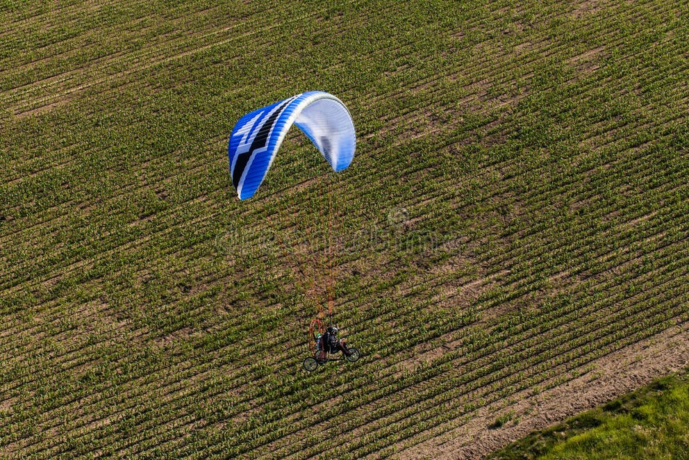 Aerial View of Paramotor Flying Over the Fields Stock Photo - Image of ...