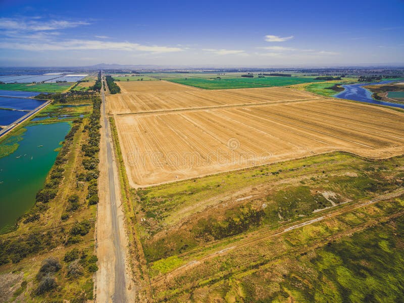 View of Plowed Field and Western Water Treatment Plant. Stock Image ...