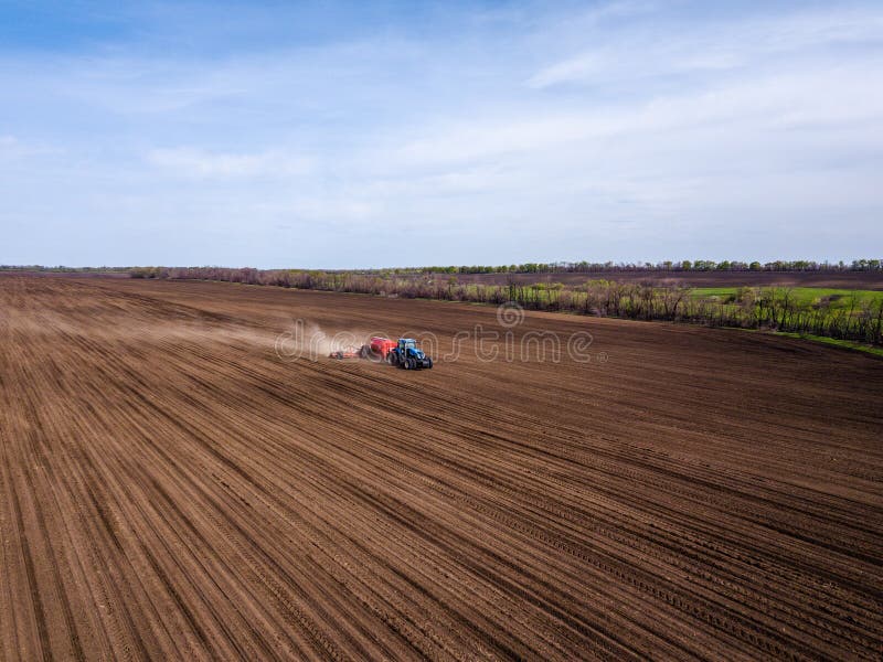 Plowing Fields with a Tractor Stock Photo - Image of plowed, wheat ...