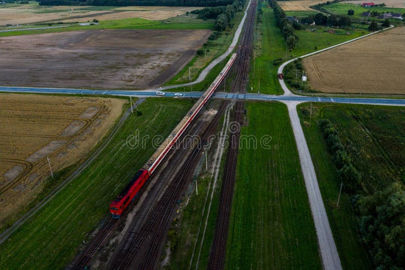 Aerial View of the Railway with a Running Passenger Train and a Railway ...