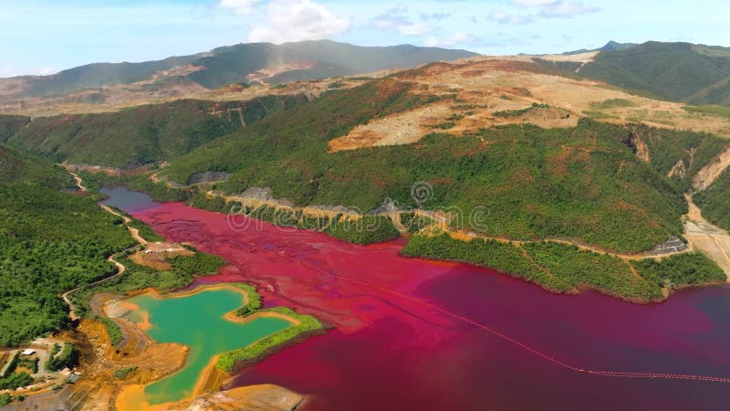 Aerial View of a Red-Colored Lake in a Deforested Mining Area Stock ...