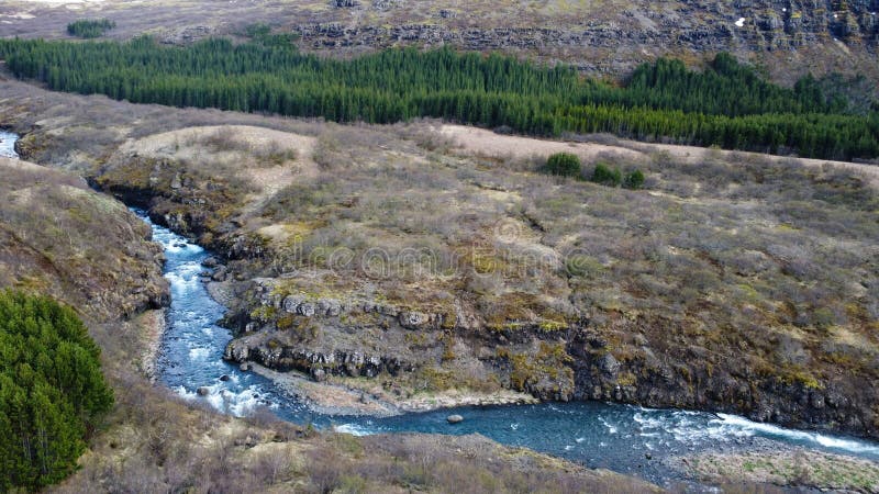 Aerial View of a River Flowing Downstream in the Middle of Cliffs Stock ...