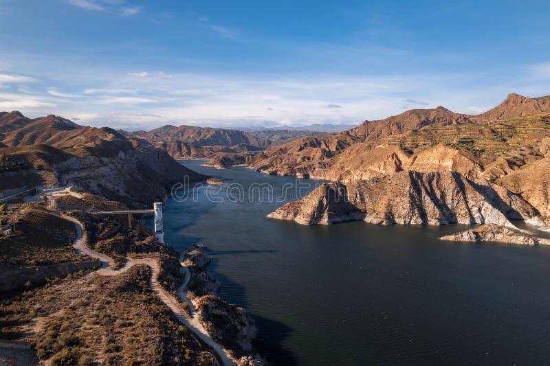 Aerial View of a River Running through a Rugged, Arid Landscape with ...