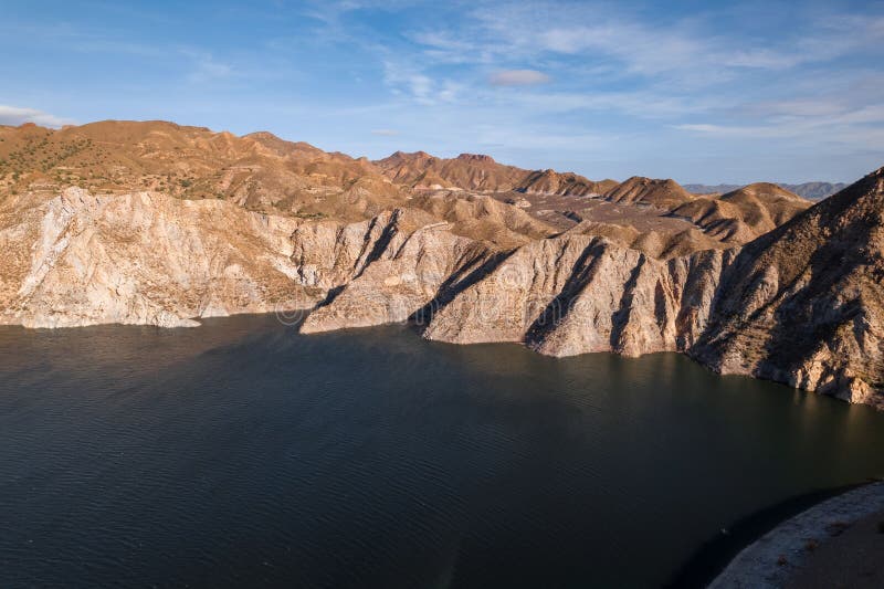 Aerial View of a River Running through a Rugged, Arid Landscape with ...