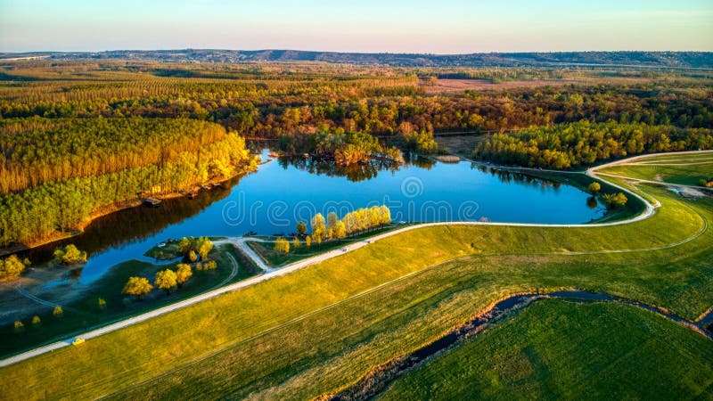 Aerial View of a River Surrounded by Forests and Fields Stock Photo ...