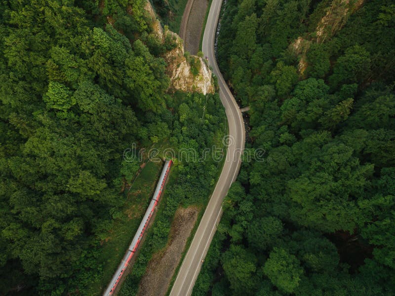 Aerial View of Road in Beautiful Mountain Forest with Train on Railroad ...
