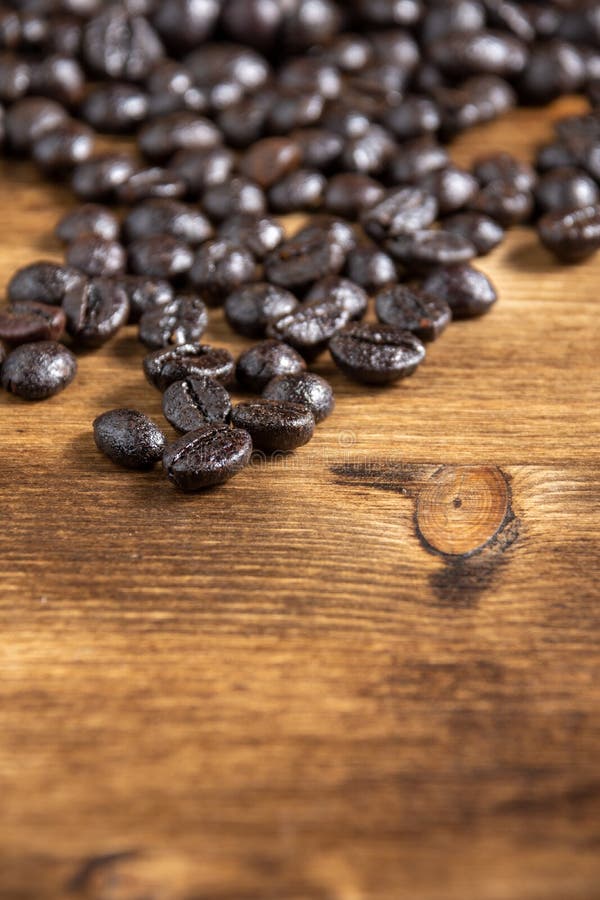 Aerial View of Roasted Coffee Beans on Rustic Wooden Table, Vertical ...
