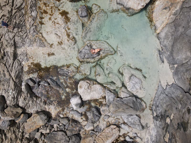Aerial View of Rock Formations with Human Sitting on Rock Stock Photo ...