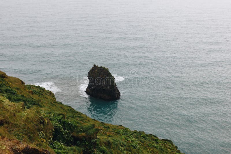 Aerial View of Rocky Cliff in Wavy Ocean Stock Photo - Image of scenery ...