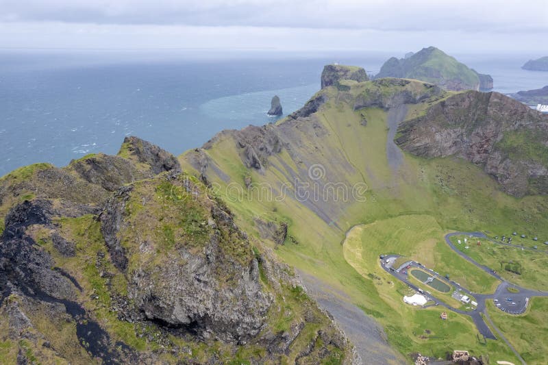 Aerial View of a Rugged Mountain with an Ocean Backdrop in ...
