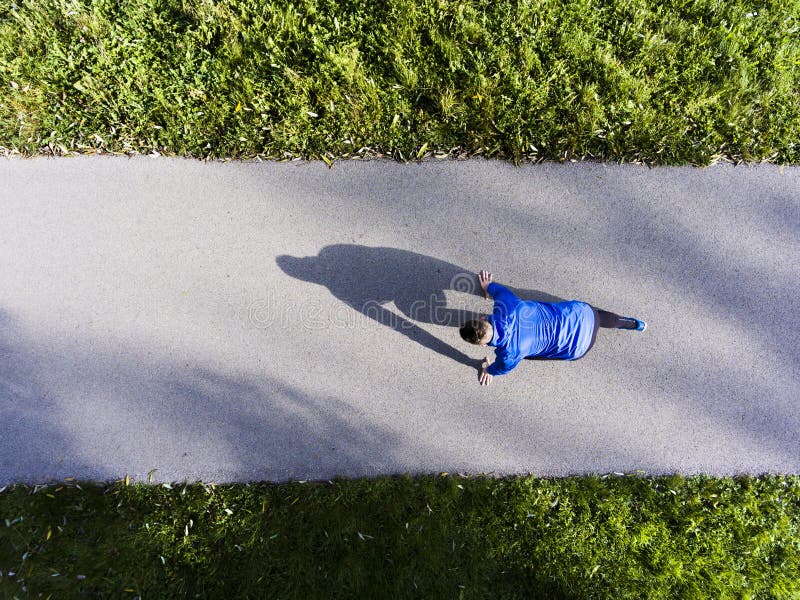 Aerial View of a Runner in Starting Position. Man Running through the ...
