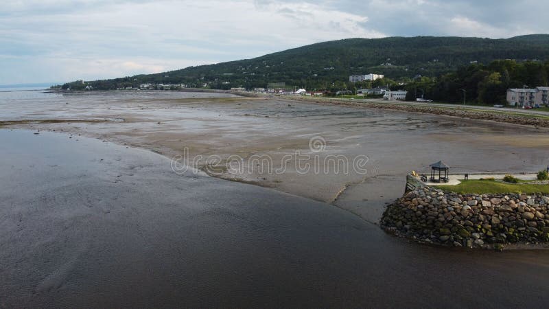 Aerial View of a Sandy Beach Featuring a Small Pier Stock Photo - Image ...
