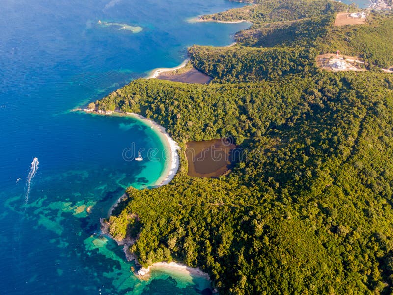 Aerial View of a Secluded Cove with Turquoise Waters and Lush Greenery ...