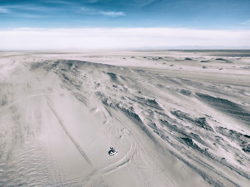 Aerial View of a Single Car on a White Sandy Terrain Stock Image ...