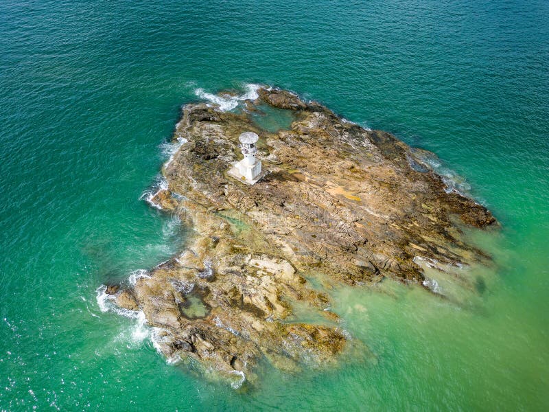 Aerial View of a Small Lighthouse Located on a Rock Offshore from a ...