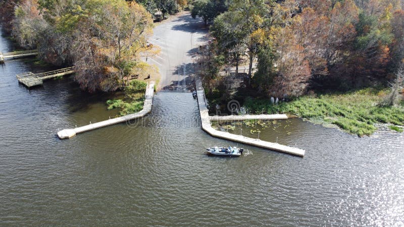 Aerial View of a Small River Channel Surrounded by Trees Seen during ...