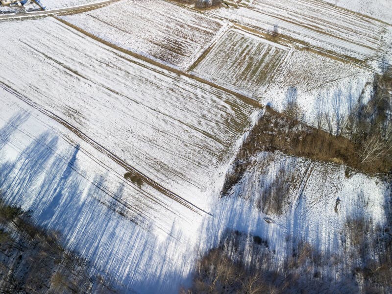 Aerial View of Snow-covered Fields Showcasing Patterns and Shadows ...