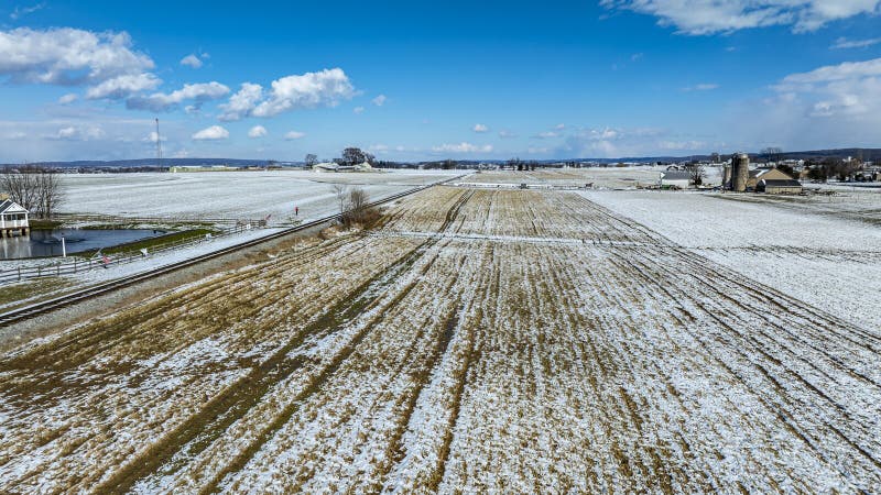Aerial View of Snow-Dusted Farm Fields with a Railroad and Silos. Stock ...