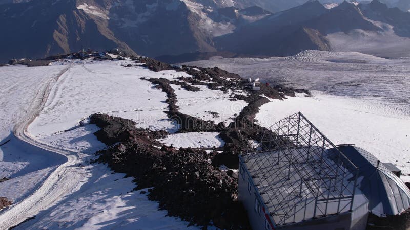 Aerial View of Snowy Slope with Base Camp and Abandoned Structures ...