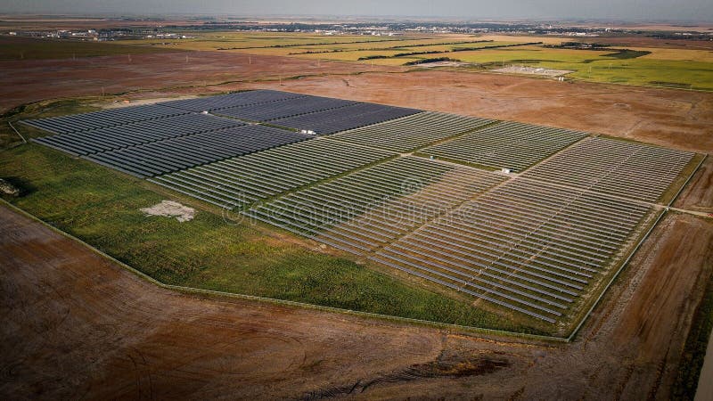 Aerial View of Solar Panels with Vast Fields in the Background Stock ...