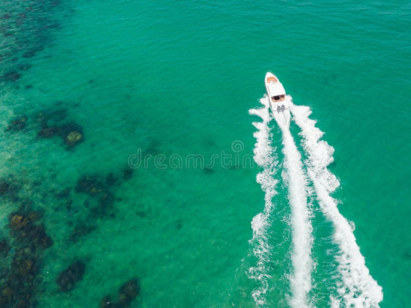 Aerial View of Speed Boat at High Speed in the Aqua Sea, Drone View ...