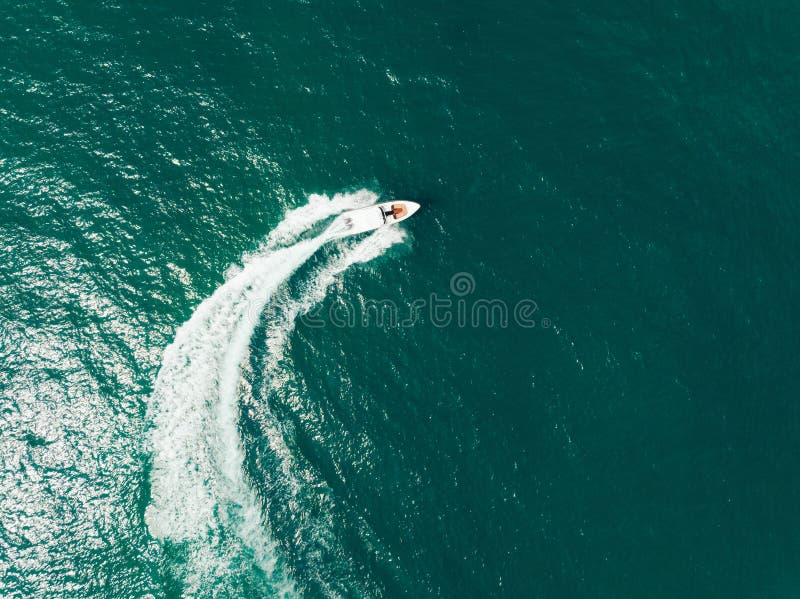 Aerial View of Speed Boat at High Speed in the Aqua Sea, Drone View ...
