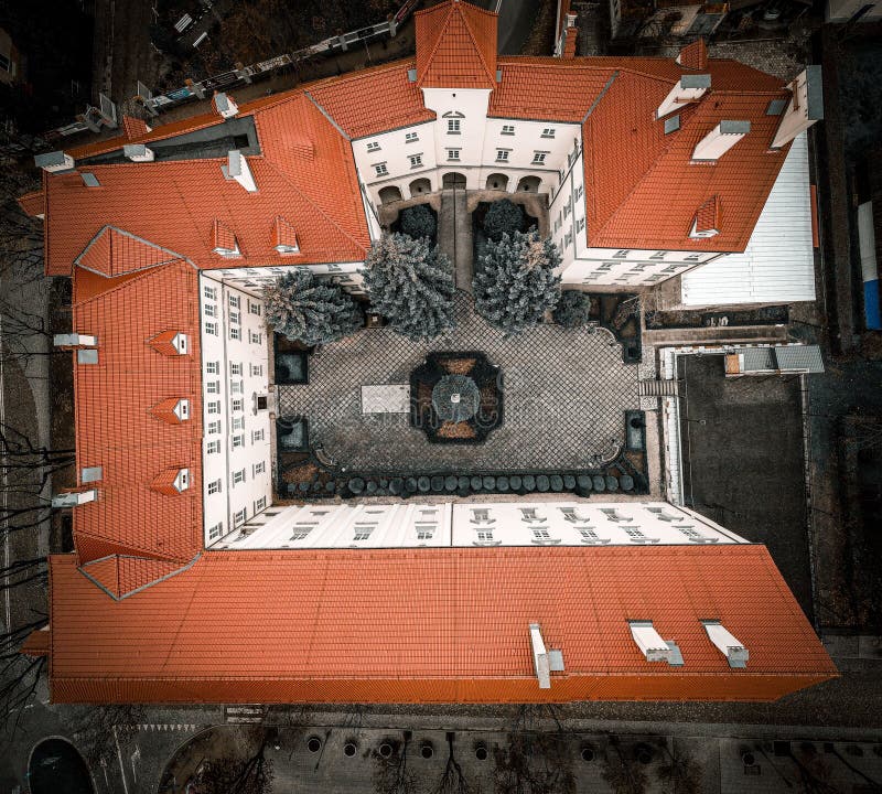 Aerial View of a Sprawling Complex Featuring a Central Fountain in ...