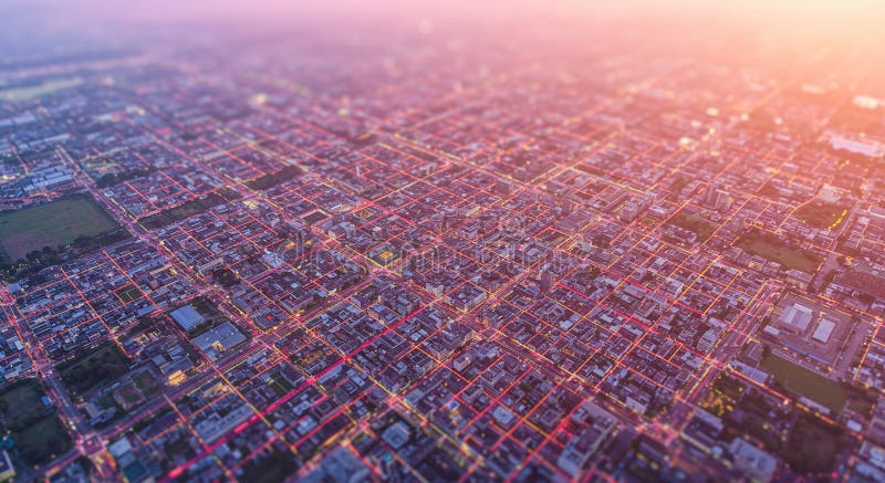 Aerial View of a Sprawling Urban Grid Pattern at Sunset, with a Network ...