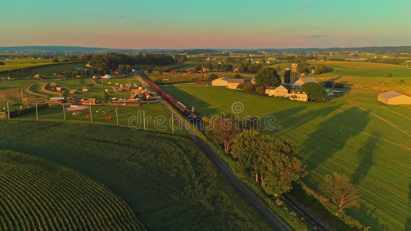 Aerial View of a Steam Passenger Train Approaching Passing Thru a Corn ...