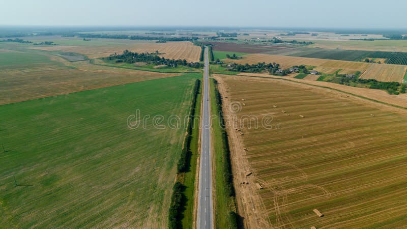 Aerial View of Straight Road with Car between Agricultural Fields. View ...