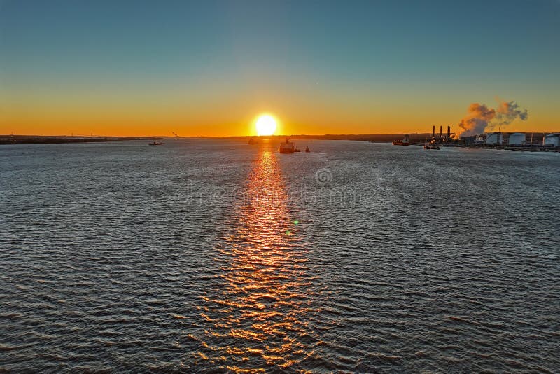 Aerial View of Sun Setting Over the Water Stock Photo - Image of river ...
