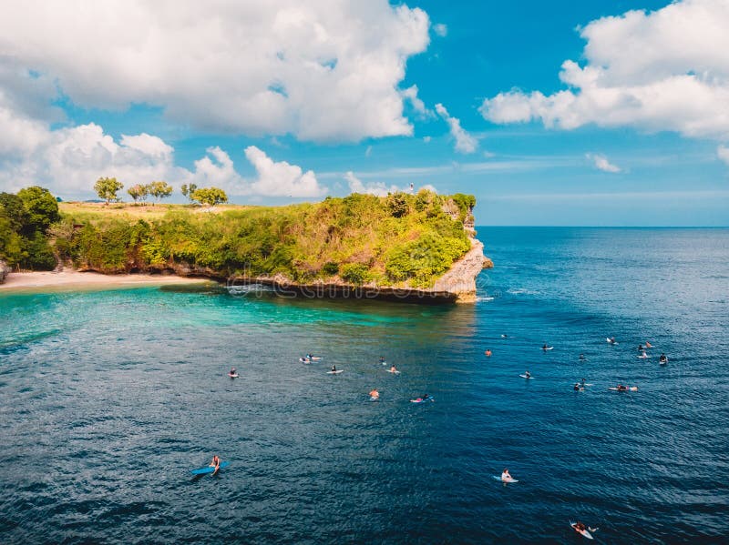 Aerial View with Surfers in Tropical Blue Ocean and Cape in Bali Stock ...