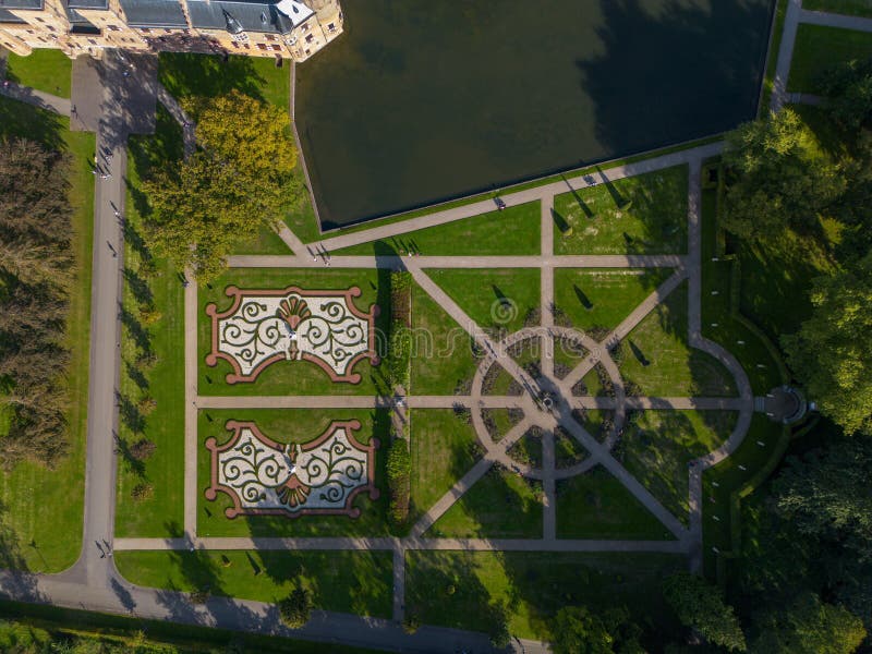 An Aerial View of a Symmetrical Garden with Paths, Flowerbeds, and ...