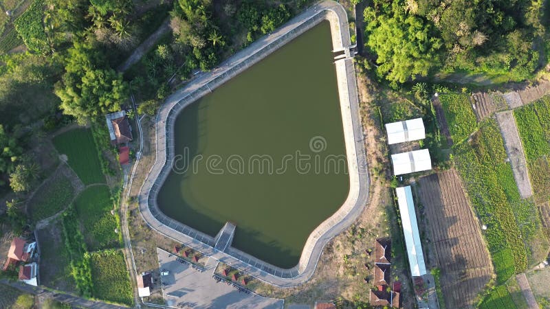 Aerial View of Symmetrical Water Reservoir Surrounded by Greenery and ...