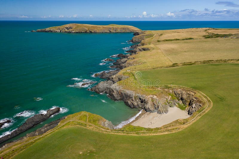 Aerial View of a Tiny Sandy Beach Surrounded by Cliffs on the Coast of ...