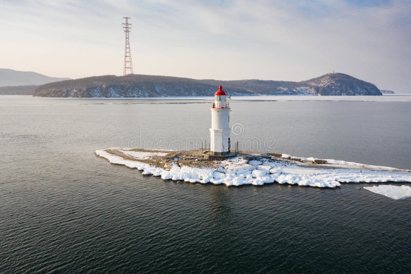 Aerial View of the Lighthouse in Winter in the Ice at Dawn Stock Image ...
