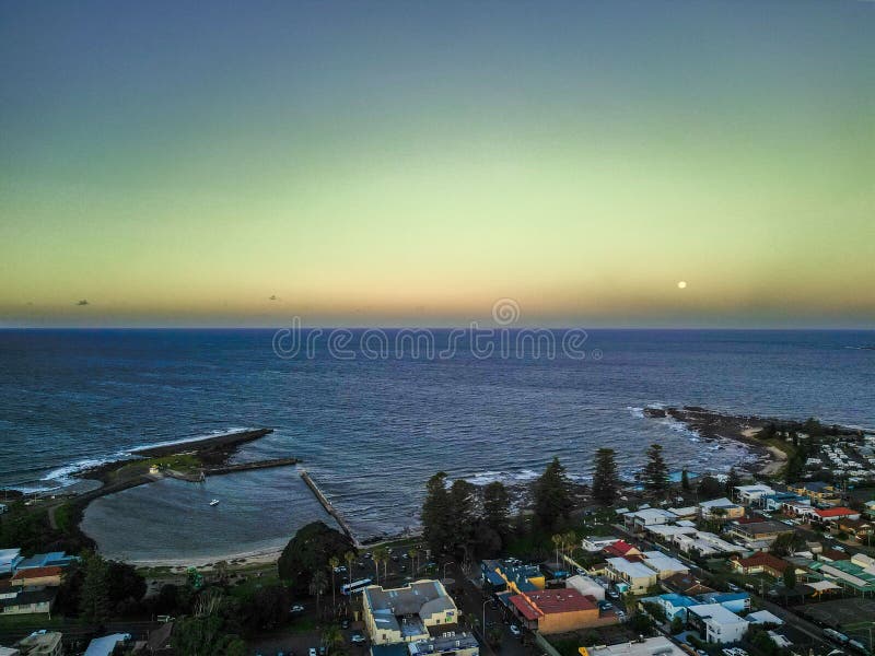 Aerial View of a Town Against the Sea at Sunset in Shellharbour ...