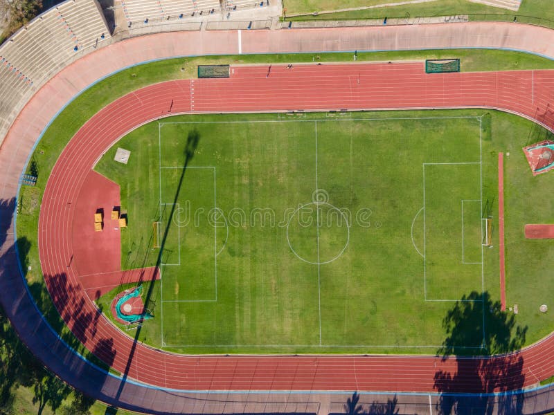 Aerial Top View on a Soccer Field, Grandstand, Football Field with Red ...