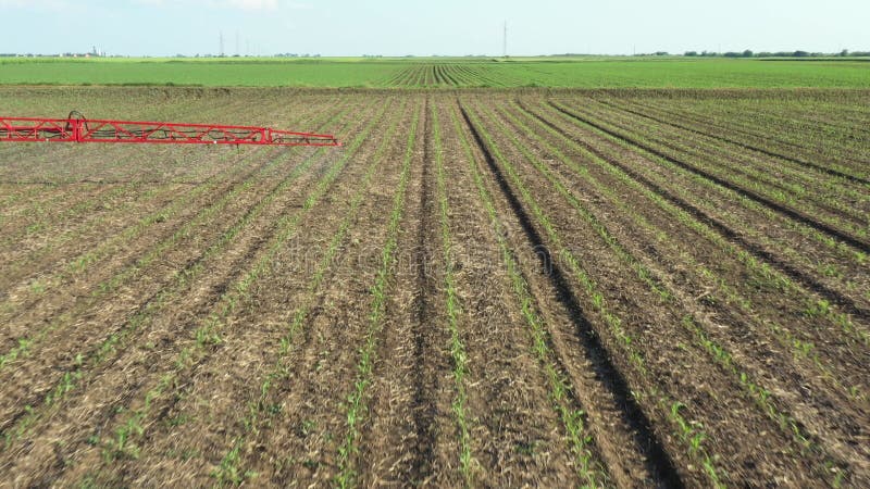 Aerial View on Tractor As Spraying Field with Sprayer, Herbicide and ... Aerial View on Tractor As Spraying Field with Sprayer, Herbicide and ...
