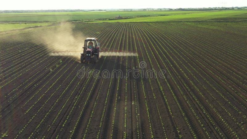 Aerial View on Tractor As Spraying Field with Sprayer, Herbicide and ... Aerial View on Tractor As Spraying Field with Sprayer, Herbicide and ...