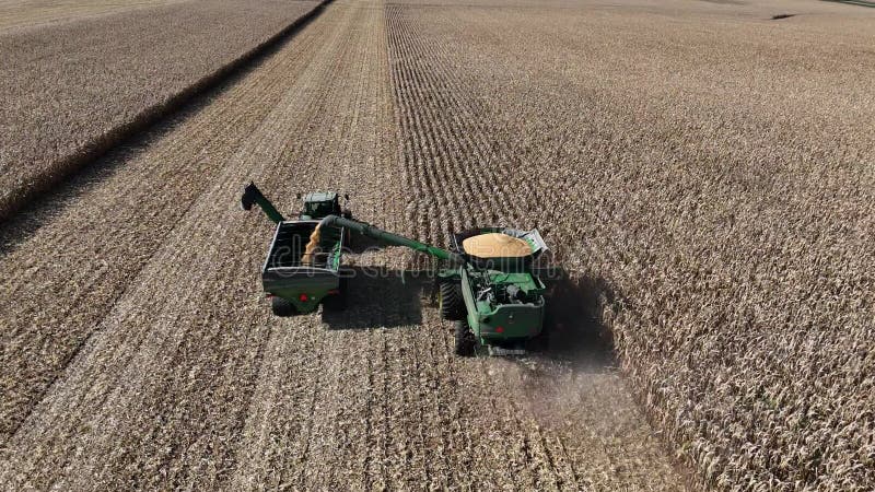 Aerial View of a Tractor Pulling a Grain Cart Being Loaded with Corn ...
