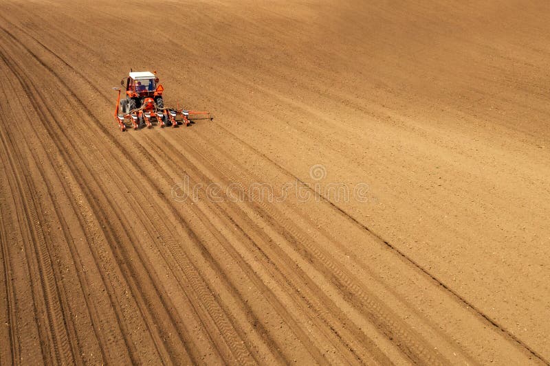 Aerial View of Tractor Sowing and Planting Corn in Field Stock Photo ...
