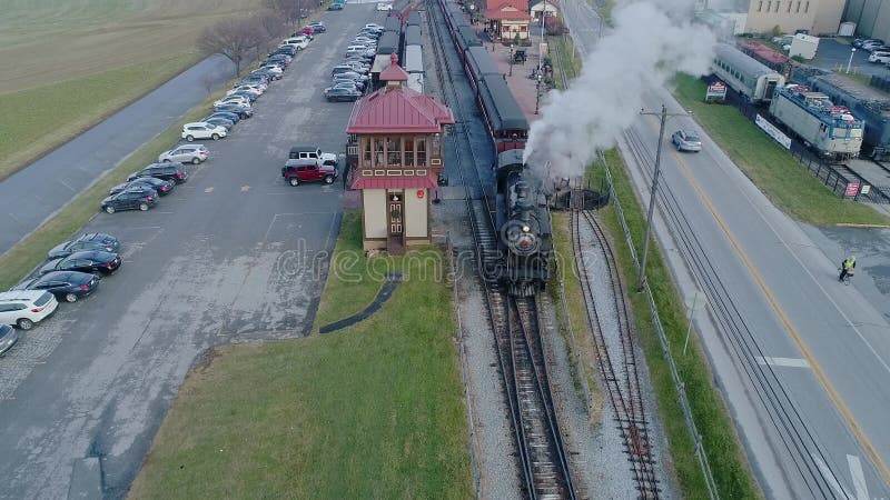 An Aerial View of a Train Station, with a Steam Passenger Train ...