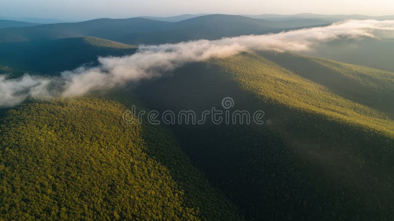 Aerial View of Verdant Mountain Range with Rolling Clouds at Sunset ...
