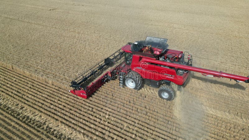 Aerial View of a Vibrant, Red Combine Harvester Working in a Field ...