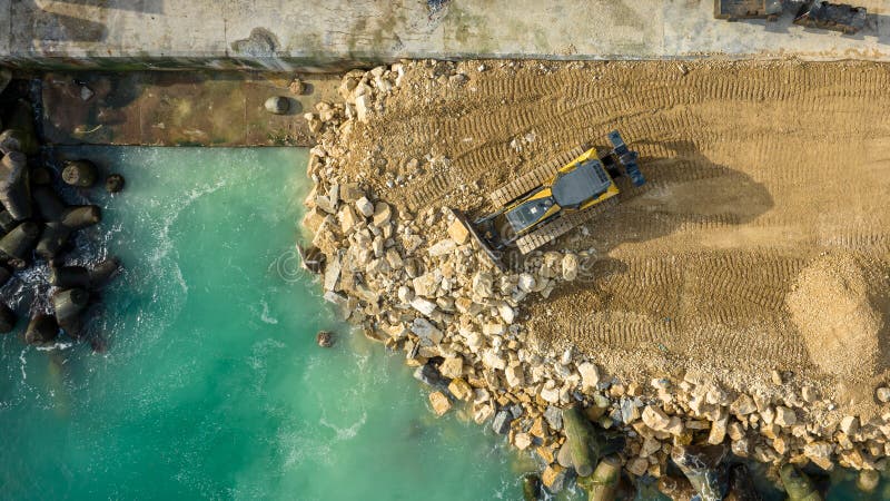 Aerial View of Waterfront Construction Site with Excavator. Bulldozer ...