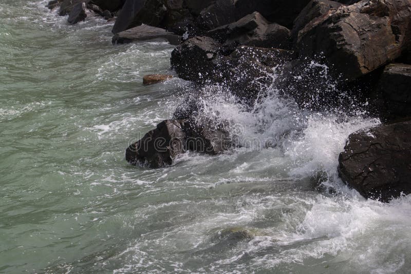 Aerial View of Waves Splashing on Big Rocks of a Breakwater Stock Photo ...