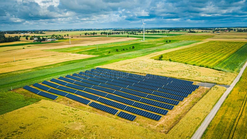 Aerial View of Wind Turbines and Solar Panel on Field Stock Image ...