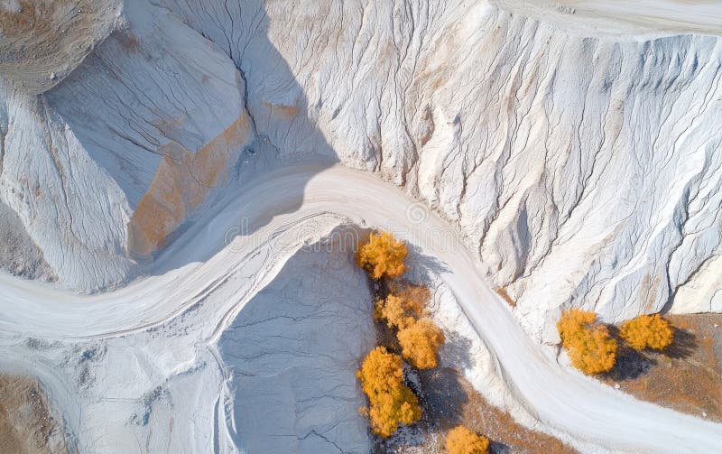 Aerial View of Winding Path through White Rocky Landscape with Yellow ...
