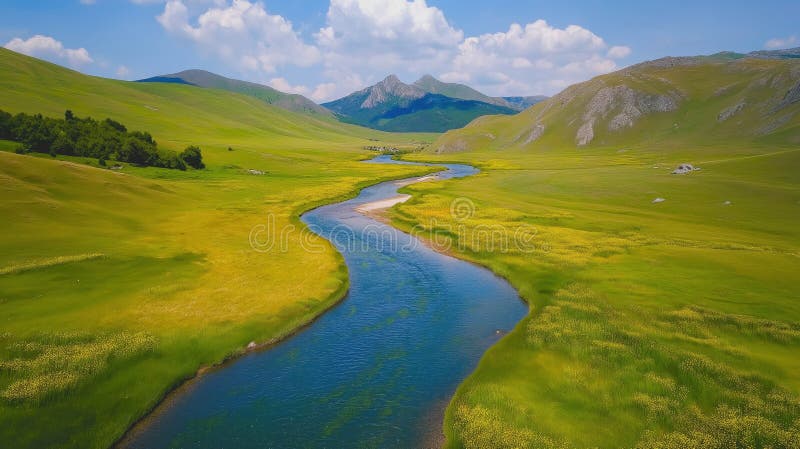 Aerial View of a Winding River through Lush Green Fields and Rolling ...
